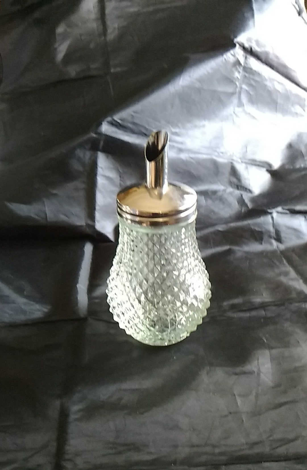 A Grace Diamond Designed Syrup Dispenser With a Chrome Lid With a Spout ...