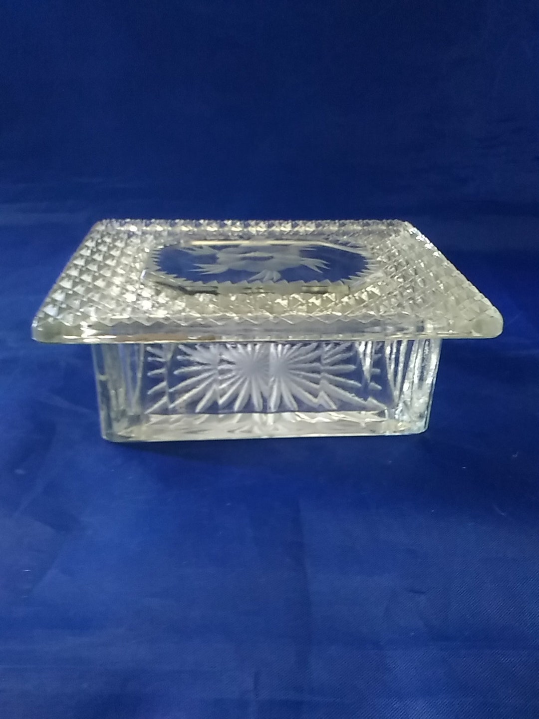 A Clear Ribbed Glass Cigarette Box With a Floral Etched Lid With the ...