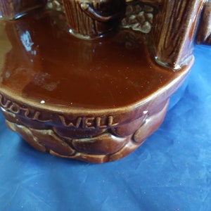 A Mccoy Pottery USA Planter That is a Glazed Brown Stone Well With a ...