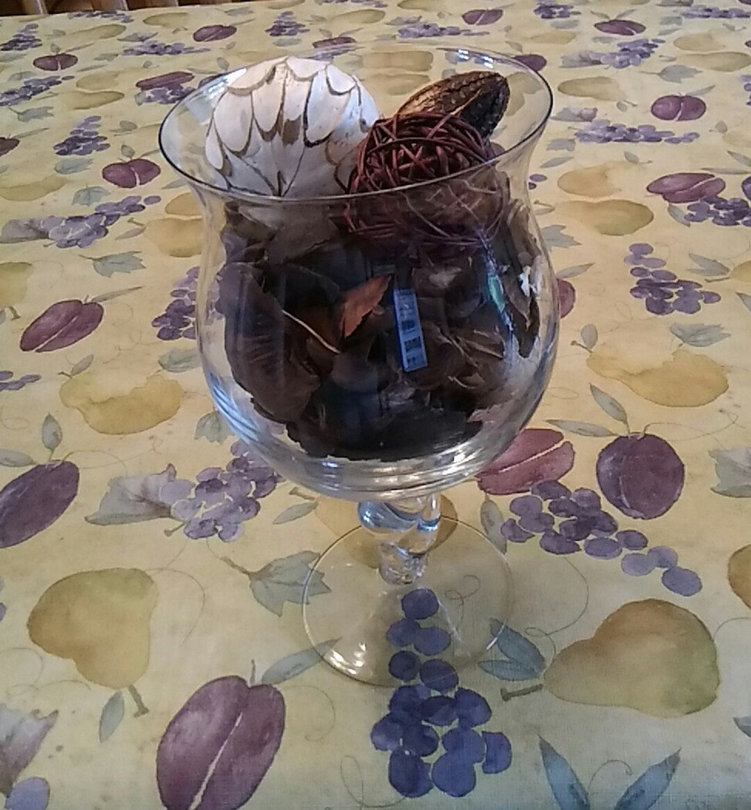 A Clear Glass Compote With a Twisted Glass Stem, Filled With Pot Poured ...