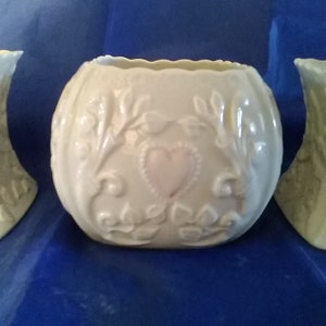 A 4 Piece Belleek Claddagh off White Ceramic Candleholder of an ...