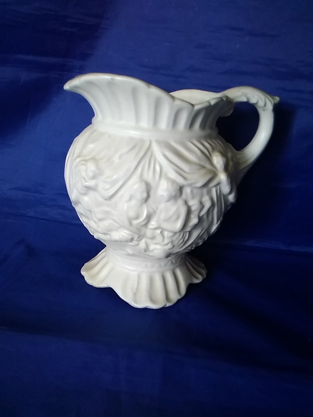 A Marked Inarco Footed White Ceramic Creamer or Small Pitcher Embossed ...