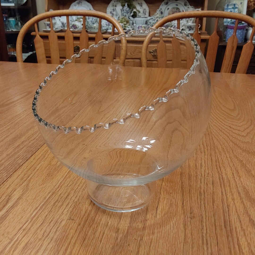 An Unusual Clear Glass Footed Bowl With a Decorative Scalloped Rim on ...
