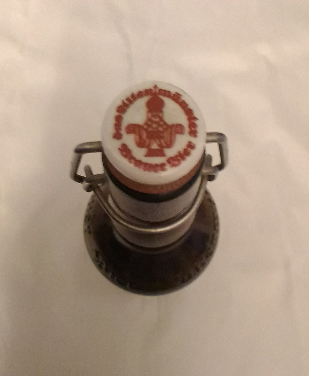 An Empty Brauer Bier Embossed Brown Beer Bottle With a Bale Wire and ...