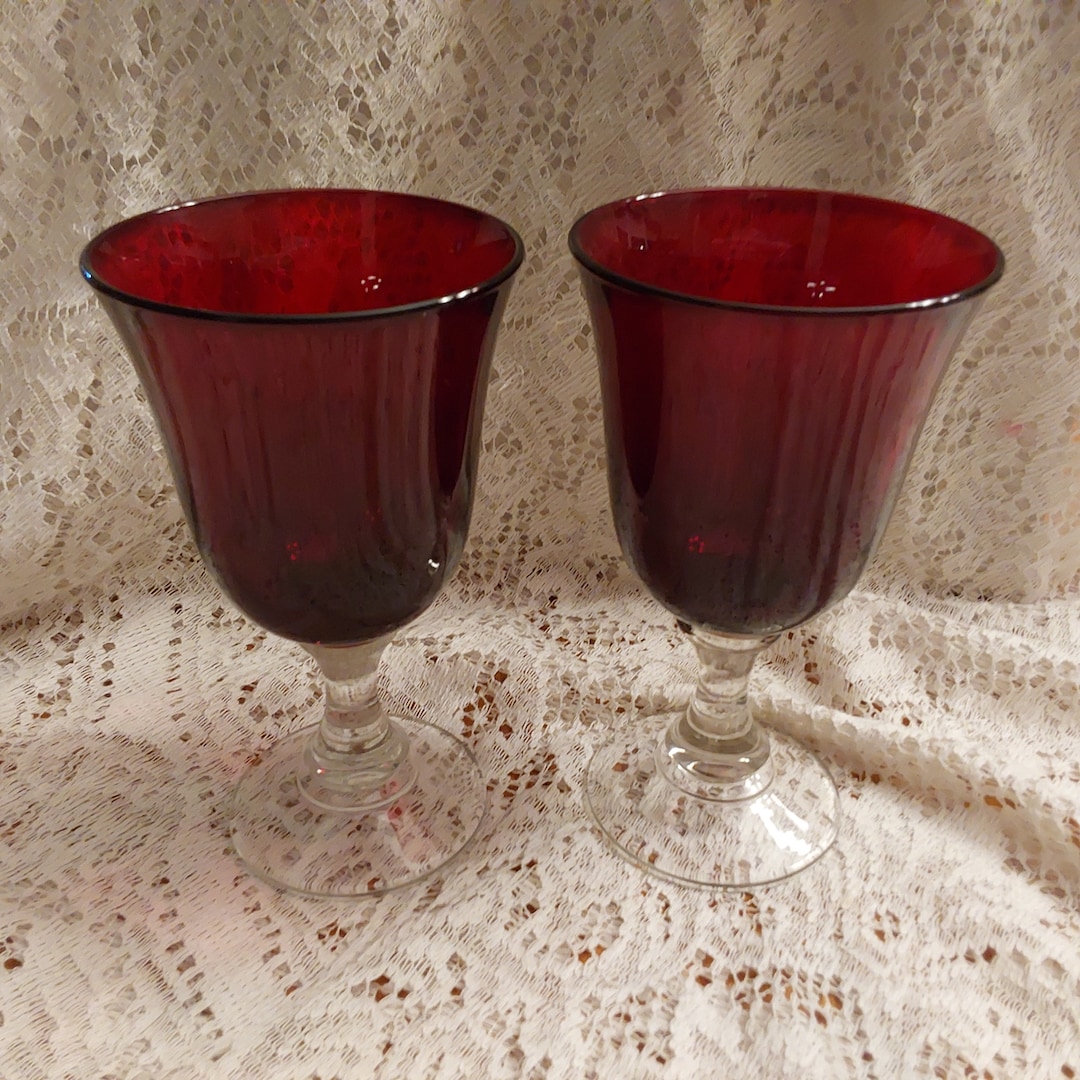 A Pair of Flared Ruby Red Glass 12 Oz Water Goblets on Clear Glass ...