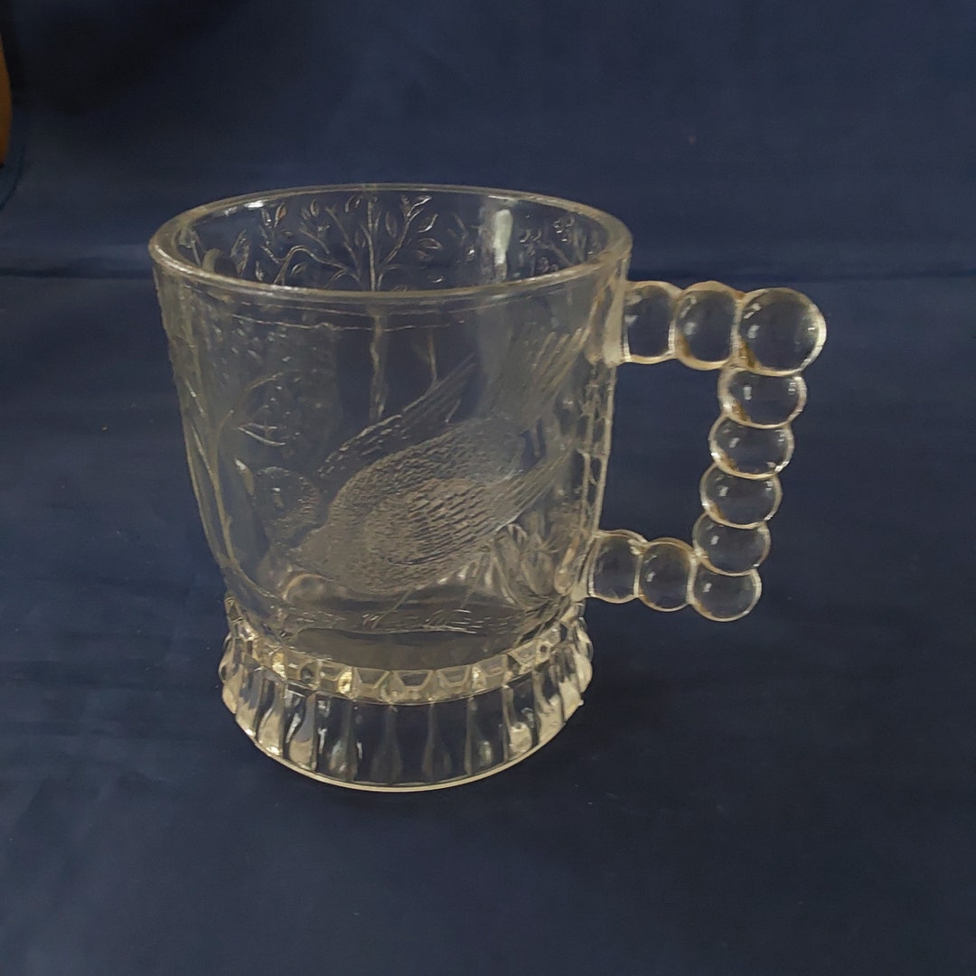 A 19th Century Bryce Glass Footed Mug With Etched Birds and a Squared ...