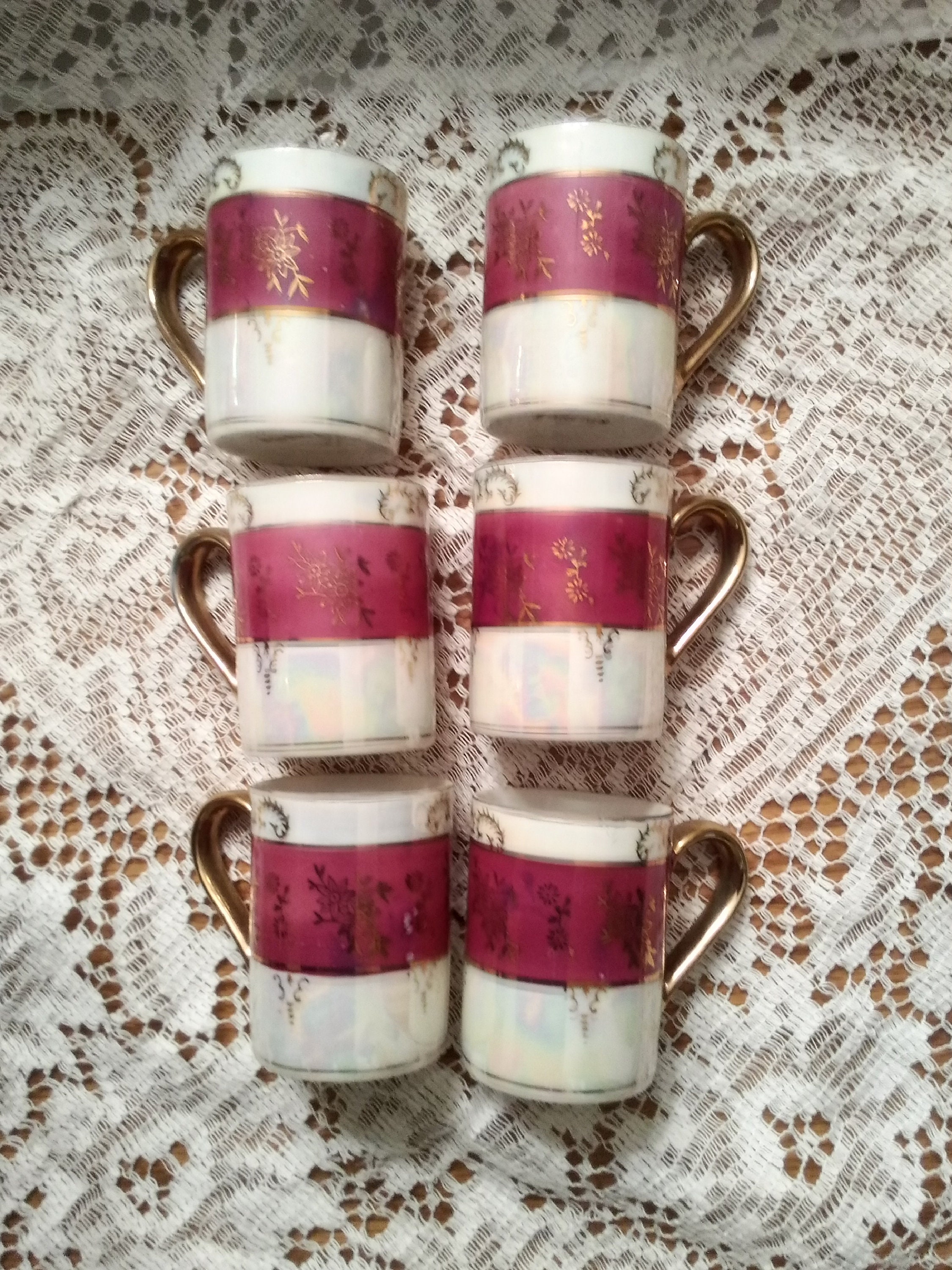 A 15 Piece Porcelain Tea Set in White, Maroon, and Gold Lusterware. the ...