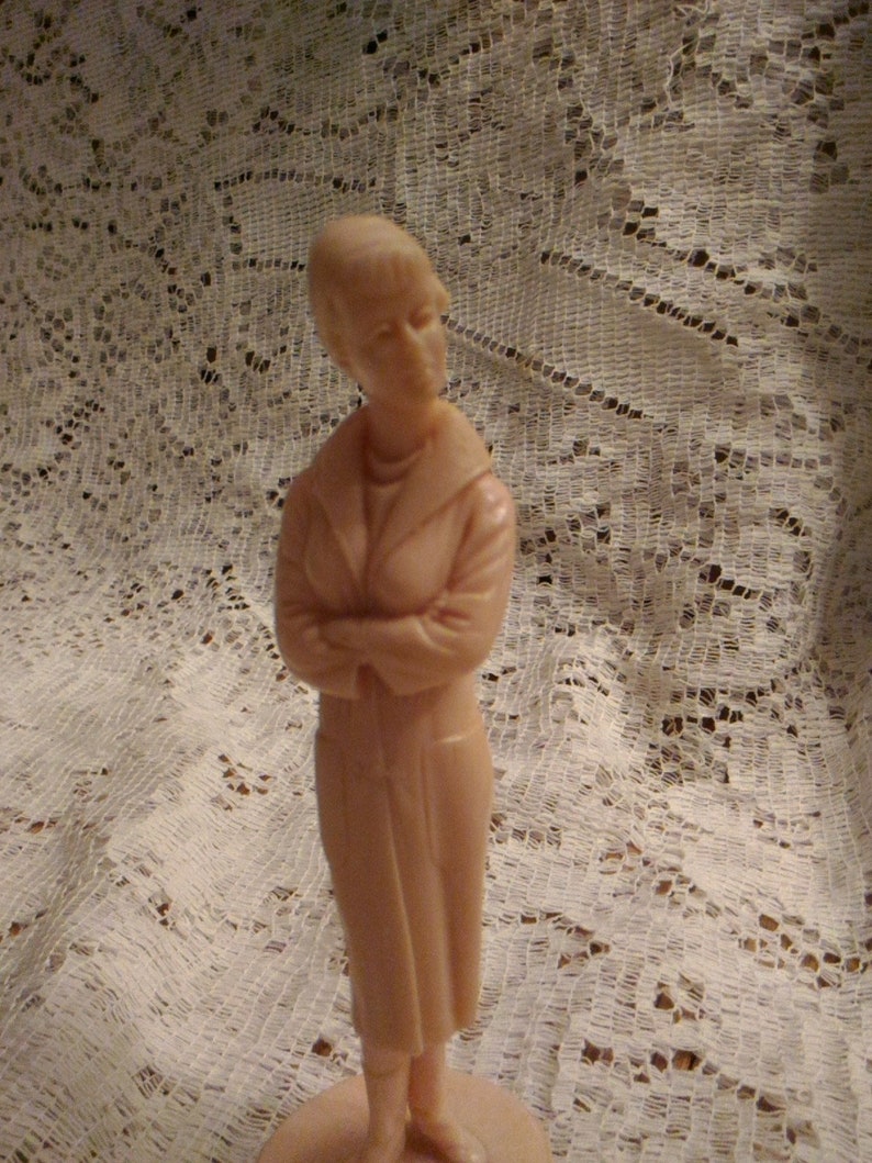 A 1964 Stormy Weather Pink Female Campus Cutie Figurine by Louis Marx ...