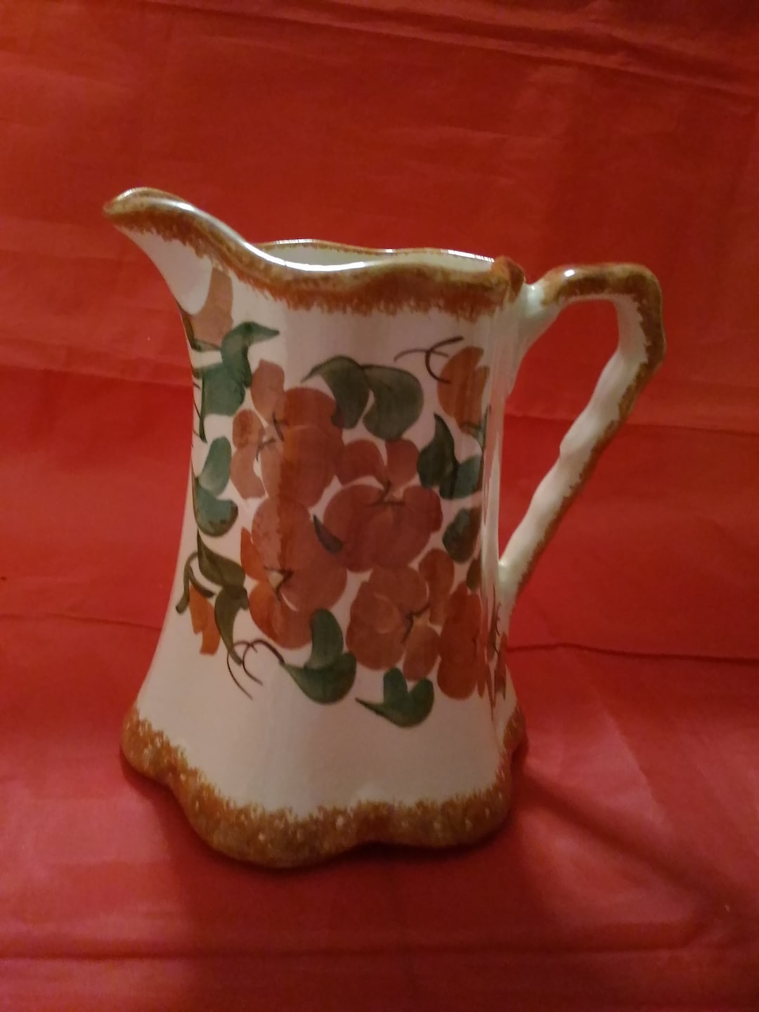 A Clinchfield Artware Glazed Ceramic Pitcher, by the Cash Family, is ...