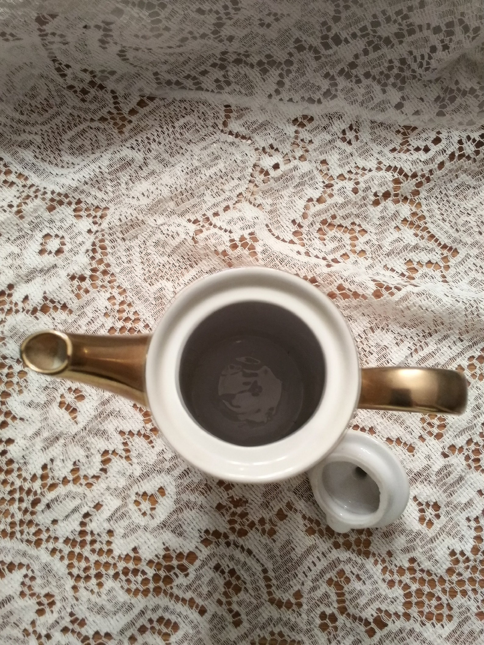 A 15 Piece Porcelain Tea Set in White, Maroon, and Gold Lusterware. the ...