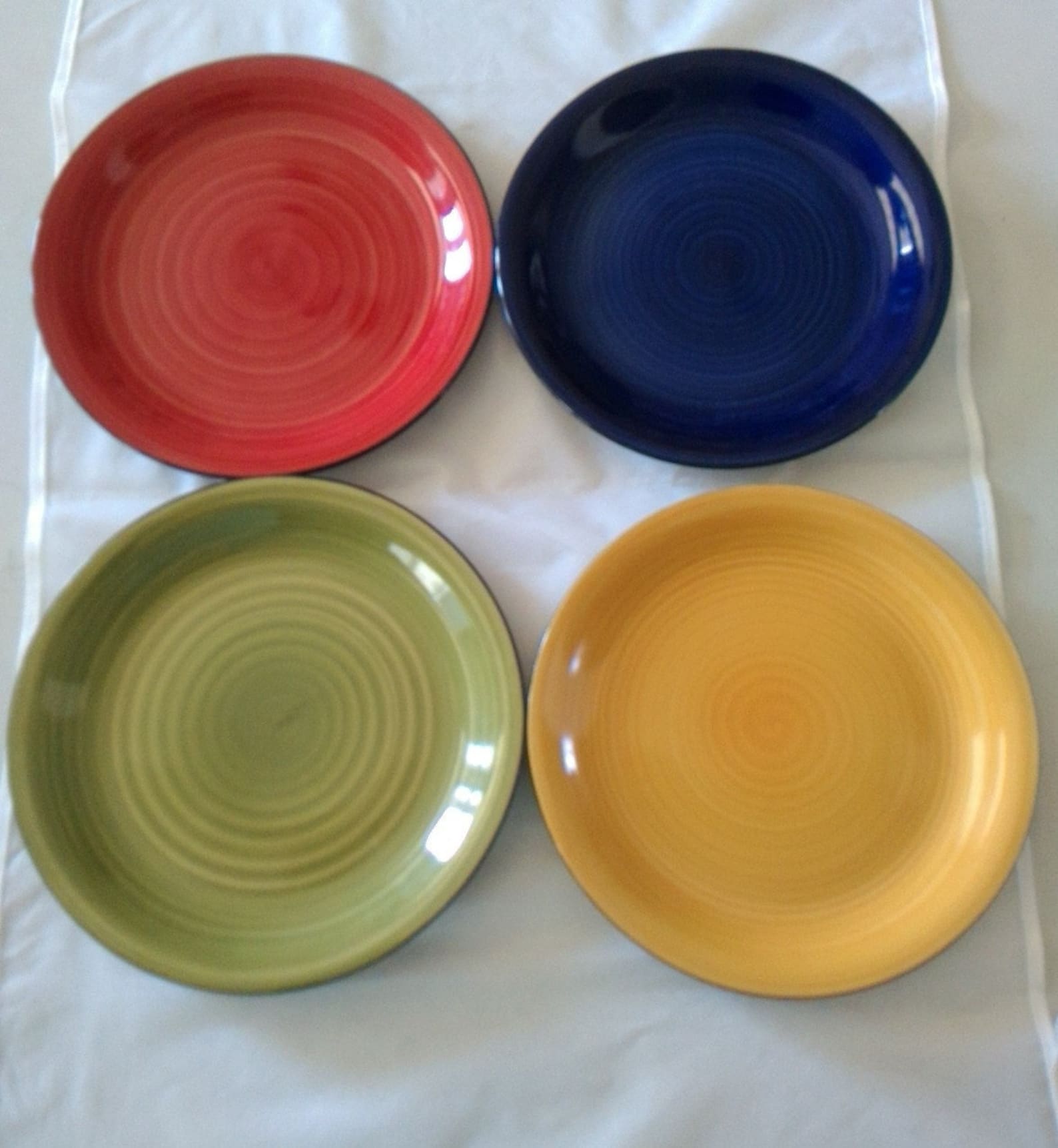 A Complete Set of 4 10.5" Gibson Dinner Plates in Their Swirled Pattern ...