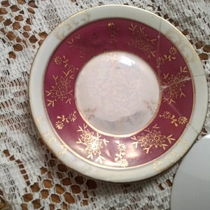 A 15 Piece Porcelain Tea Set in White, Maroon, and Gold Lusterware. the ...