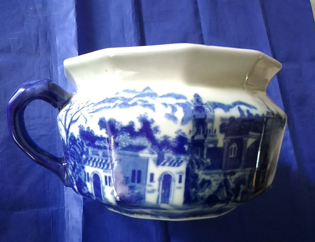 A White Victorian Style Ceramic Chamber Pot That Has a Blue Willow Ware ...