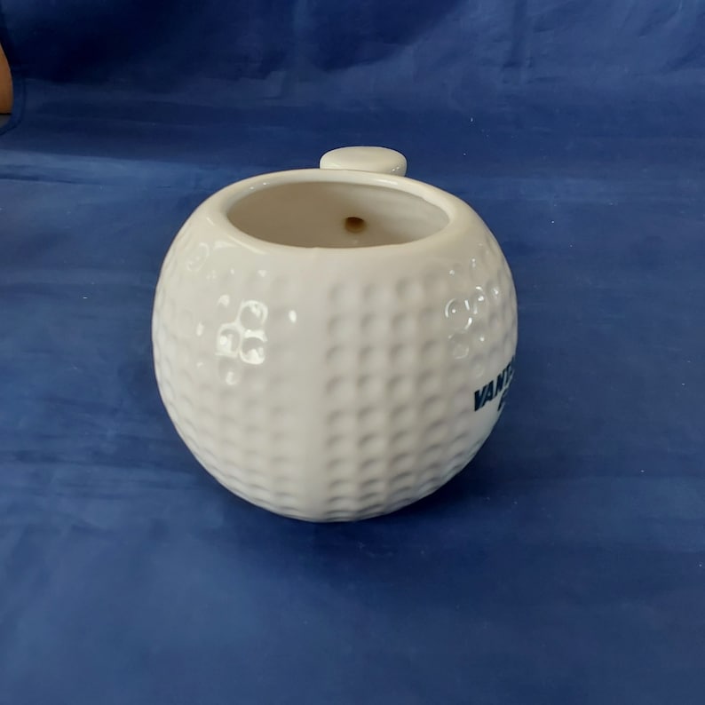 A White Ceramic Golf Ball Shaped 15 Oz Mug With a Golf Tee for a Handle ...