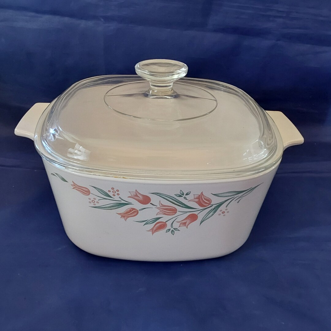 A White Corning Ware 1.5 Liter Bake Ware Dish in the Rosemarie Pink Tulip Pattern With the Clear ...