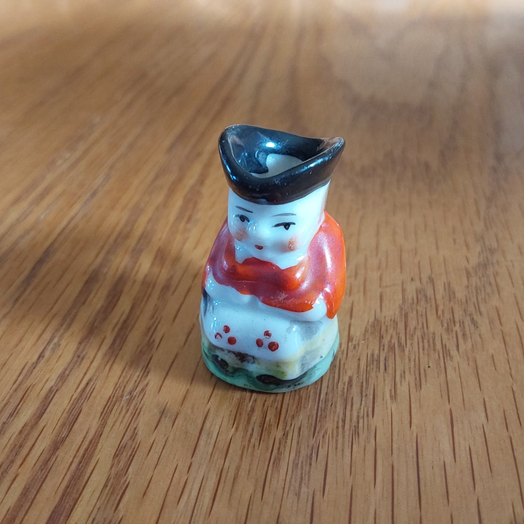 A Miniature Porcelain Toby Pitcher in Colonial Cĺothing. It is Marked ...