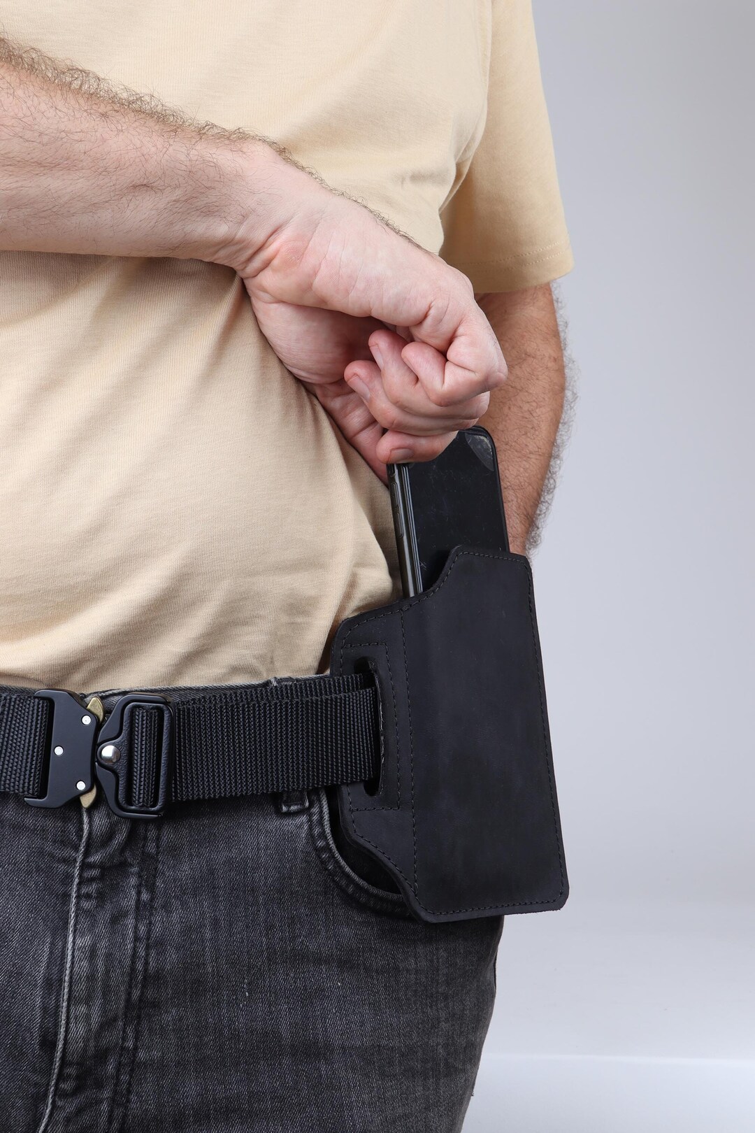 Tactical Belt With Black Leather Phone Holster Protecting Your Privacy ...