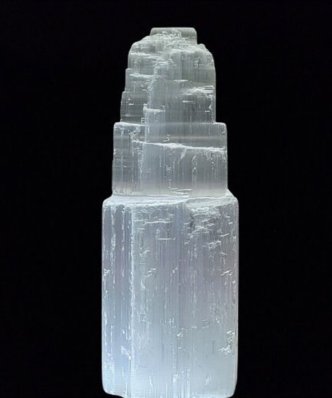 Rough Selenite Carved Tower. Colors Are From Sitting on A Colored Light ...