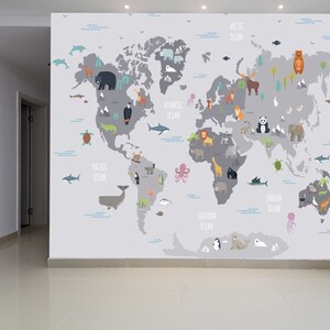 Wallpaper Mural World Map With Wild Animals Living on Various ...
