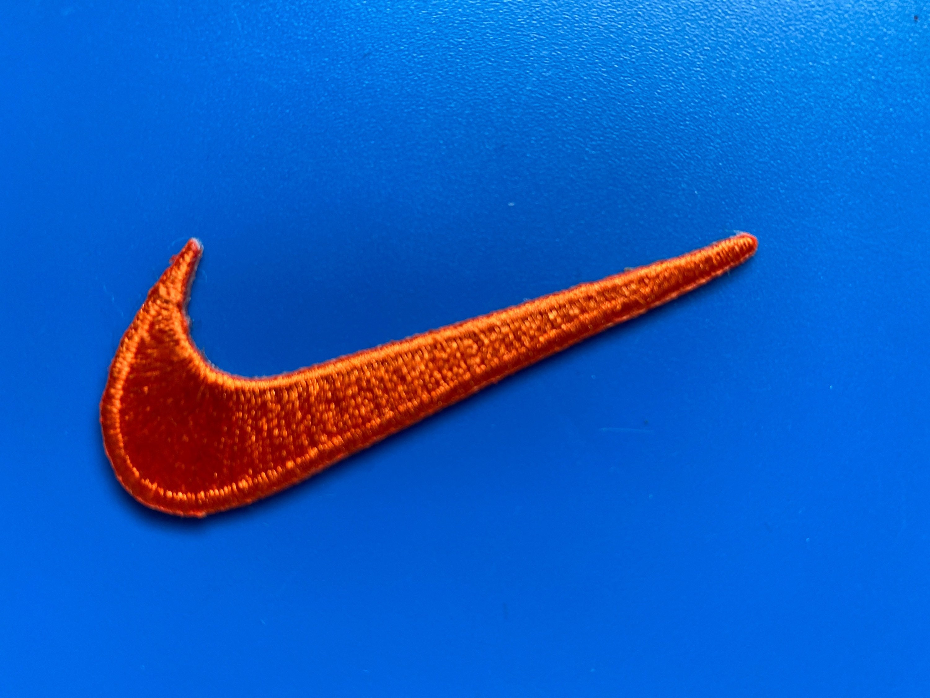 Orange Nike Swoosh