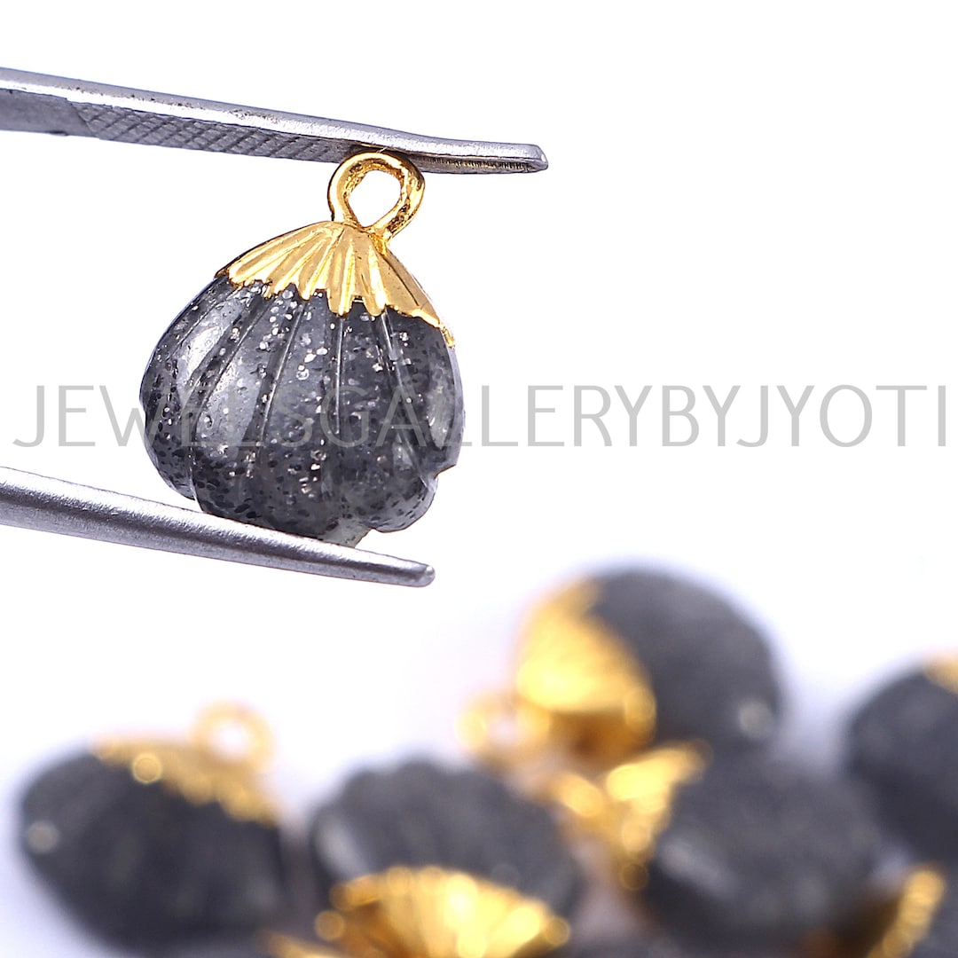 A Pair of Black Sunstone Carved Shell Charm, Electroplated Natural ...