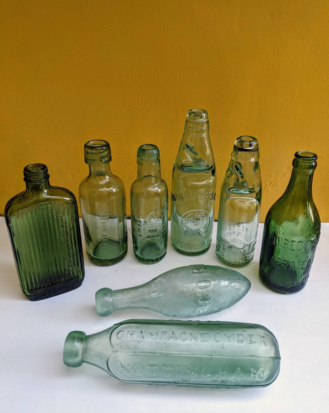 Collection of Medium Sized Antique Bottles in a Variety of Shapes ...