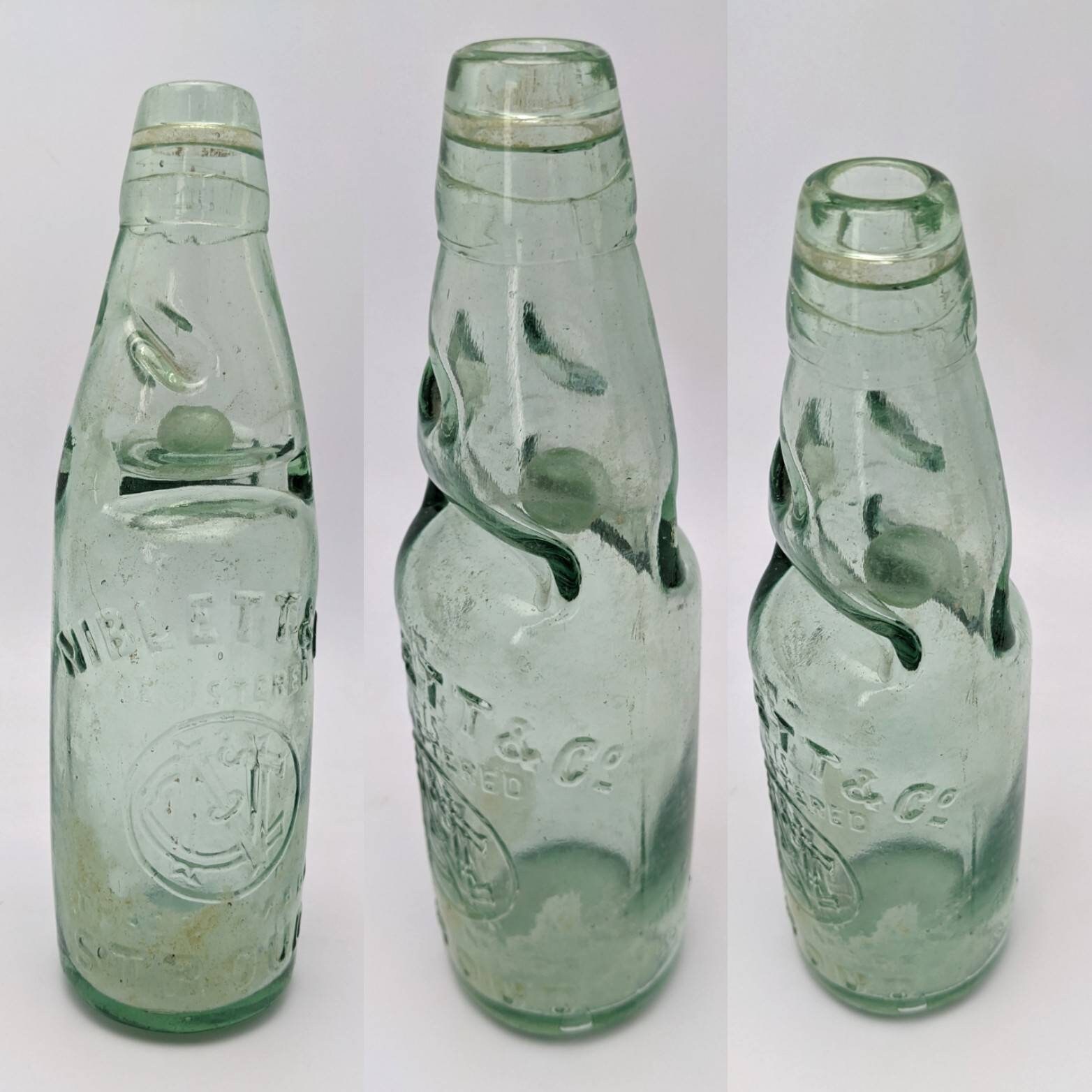 Colección de botellas antiguas de tamaño mediano en una variedad de ...
