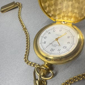 1990s Goldtone Quartz Pocket Watch With Chain, ESSO Super Tiger ...