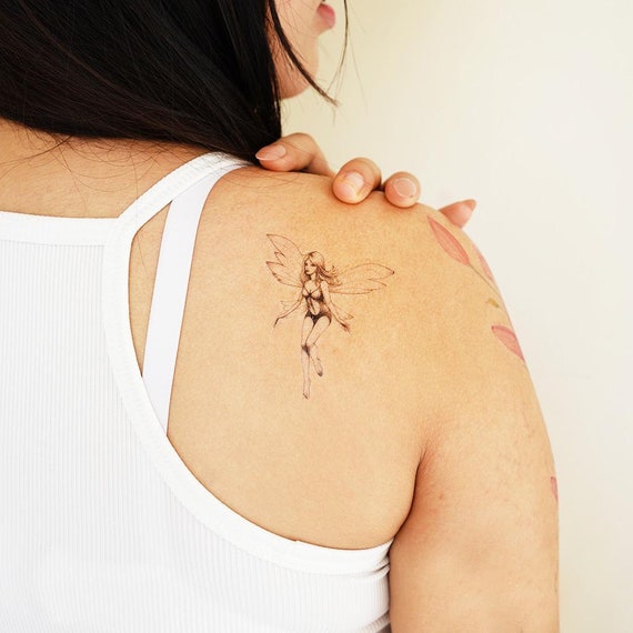 Cute fairy tattoos photos - Wisconsintattoocompany.com