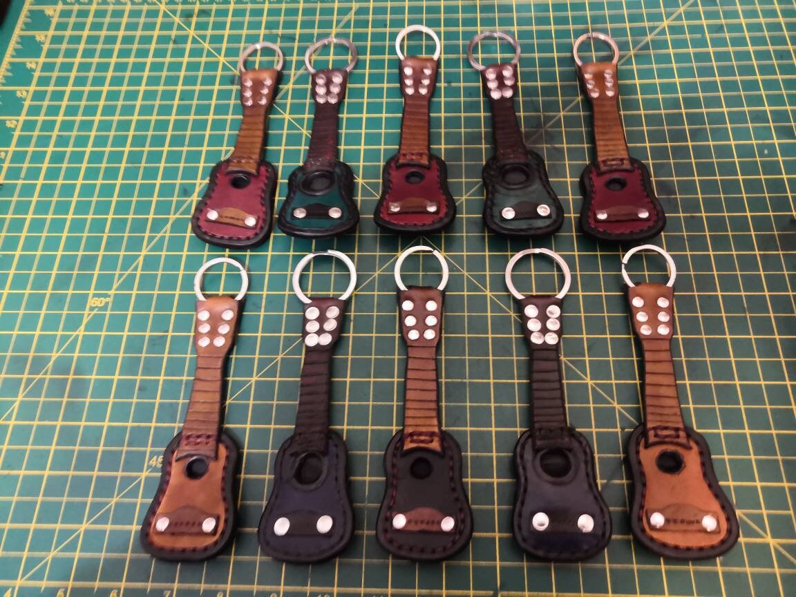 Hand made leather guitar key ring with plectrum pouch. | Etsy