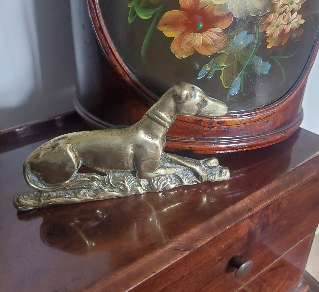 A Victorian Brass Poker Stand in the Form of a Recumbent Long Dog. of ...