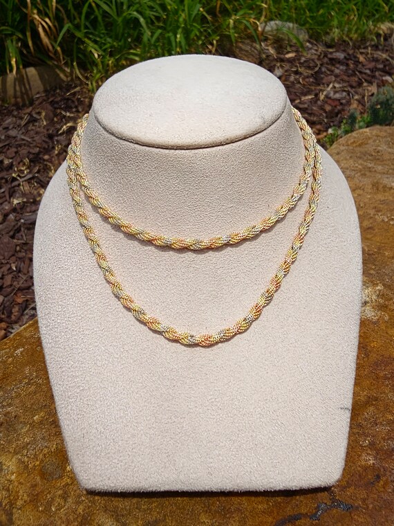 Circa 1975, a 24" long x 3.3mm wide, 14k tri-gold (ye… - Gem