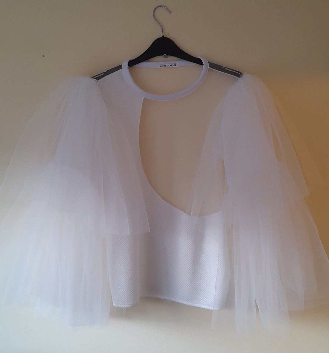 A White Textured T-shirt With a Fine Tulle Circular Cutout Front and ...
