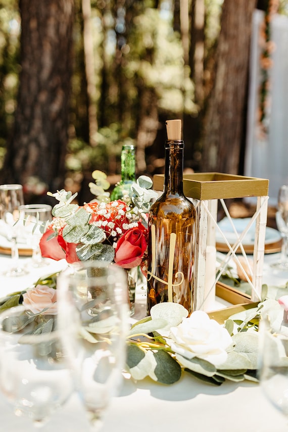 Wine bottle wedding table centerpieces | Beachweddingtips.com
