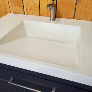 Bathroom Vanities A Bathroom Vanity With A Slot Drain Ramp Sink ...
