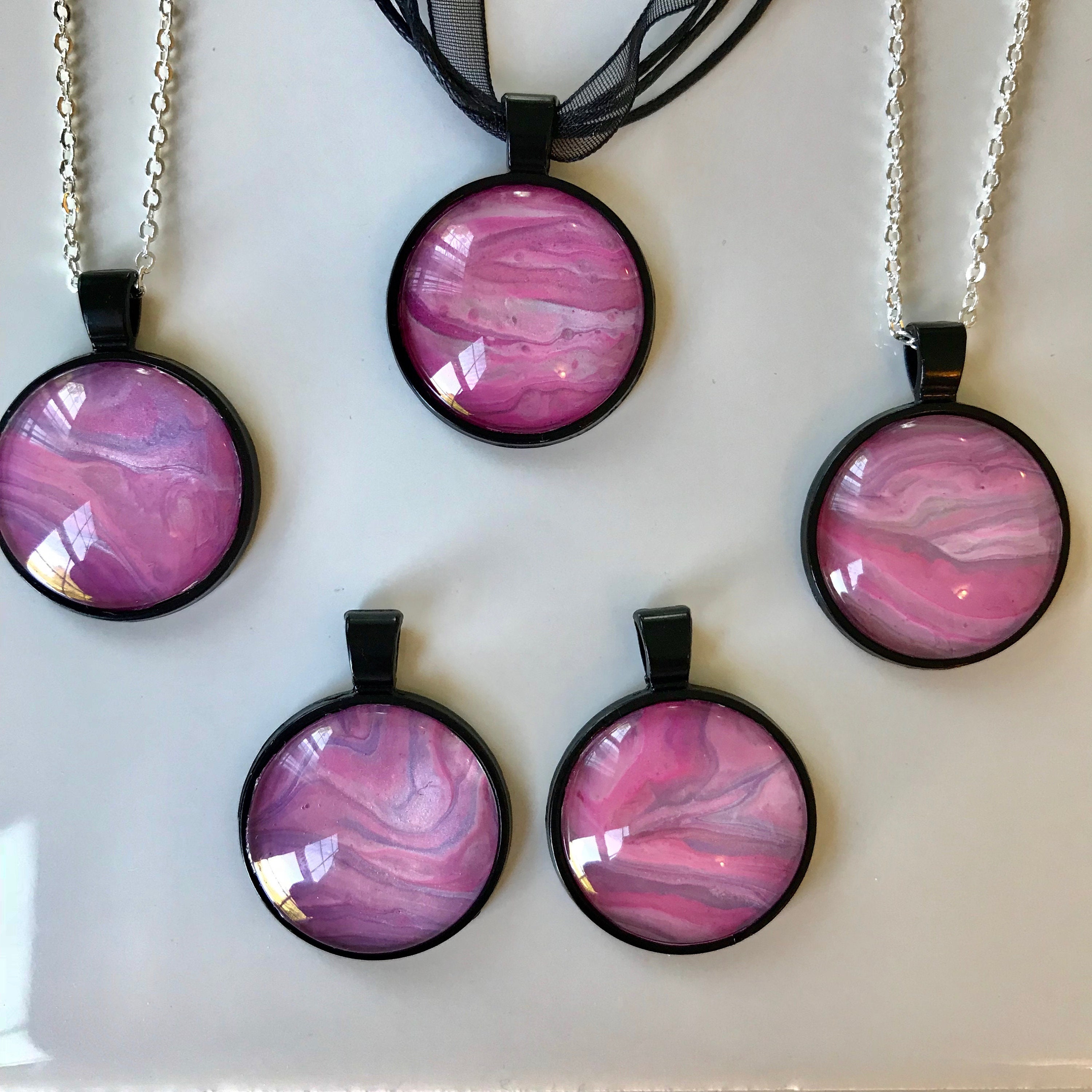 Pink Exoplanet in black setting necklace acrylic pour | Etsy