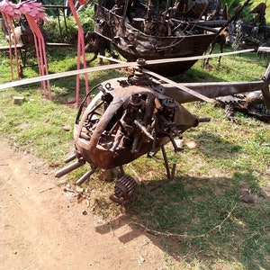 African Scrap Art Replica Helicopter in Action Sculpture | Green Art ...