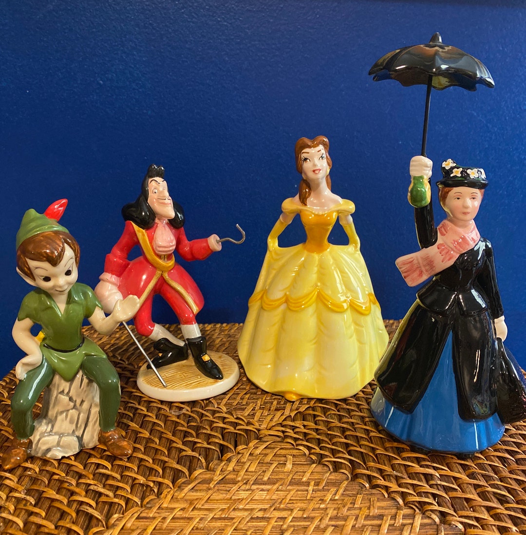 Four Vintage Disney Porcelain Figurines- Belle, Peter Pan, Captain Hook ...