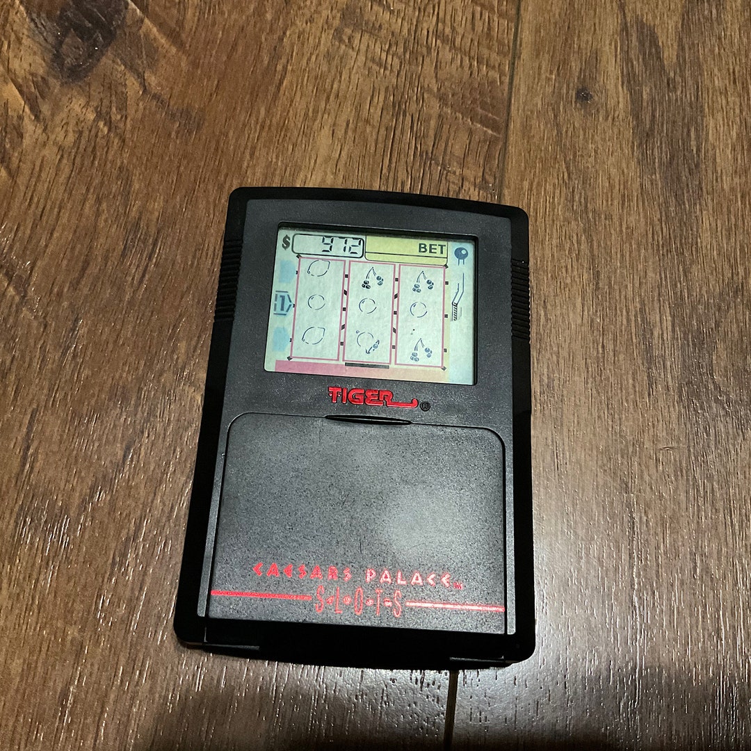 1993 Tiger Electronics Caesar’s Palace Slot Machine Electronic Handheld ...
