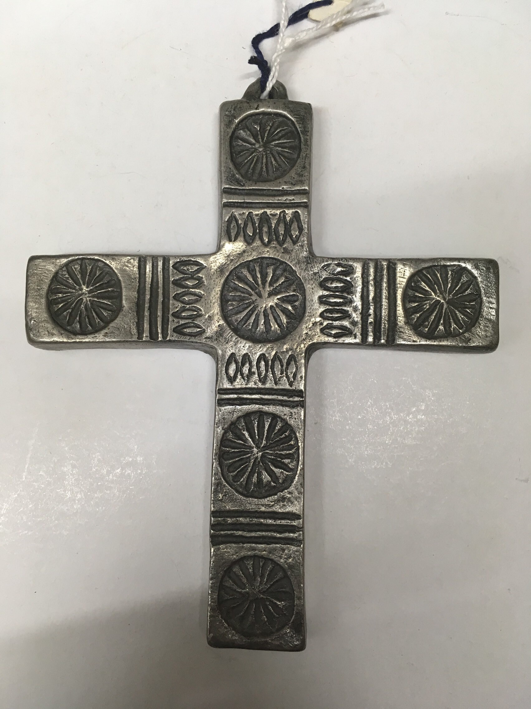 Art of religious tin. Pewter cross by the artist Arlette Laurent Dray