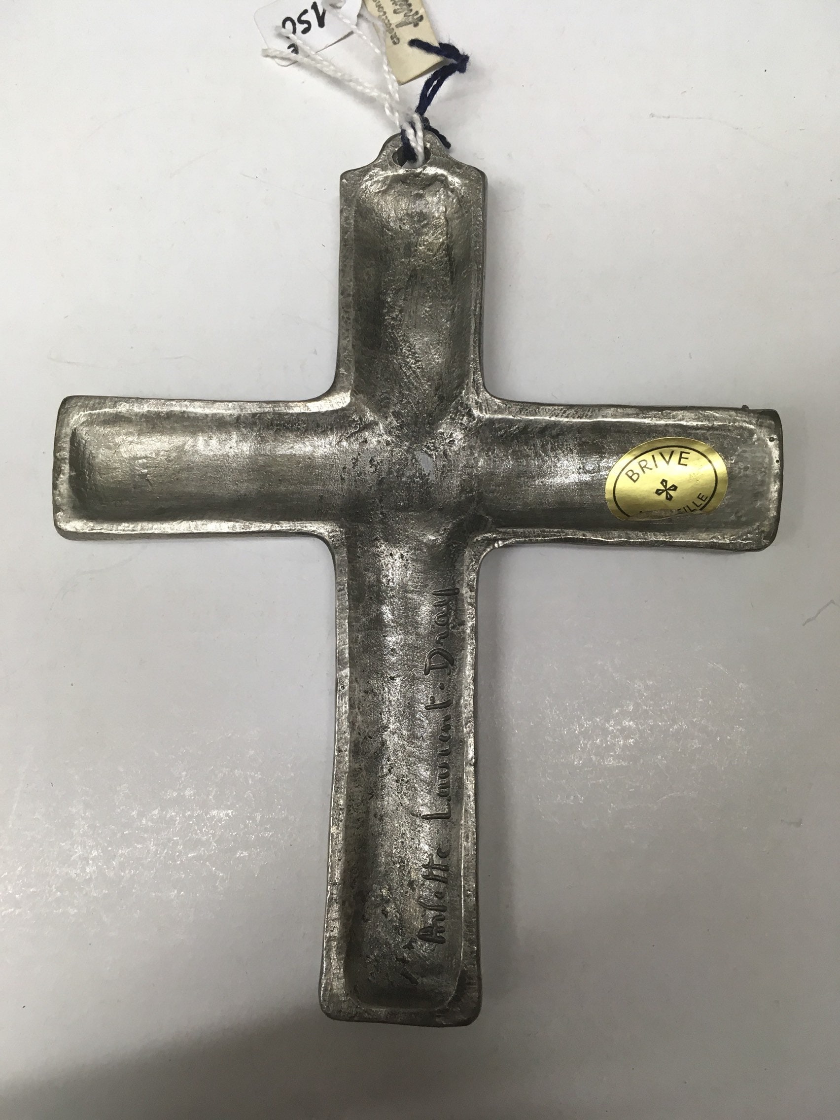Art of religious tin. Pewter cross by the artist Arlette Laurent Dray