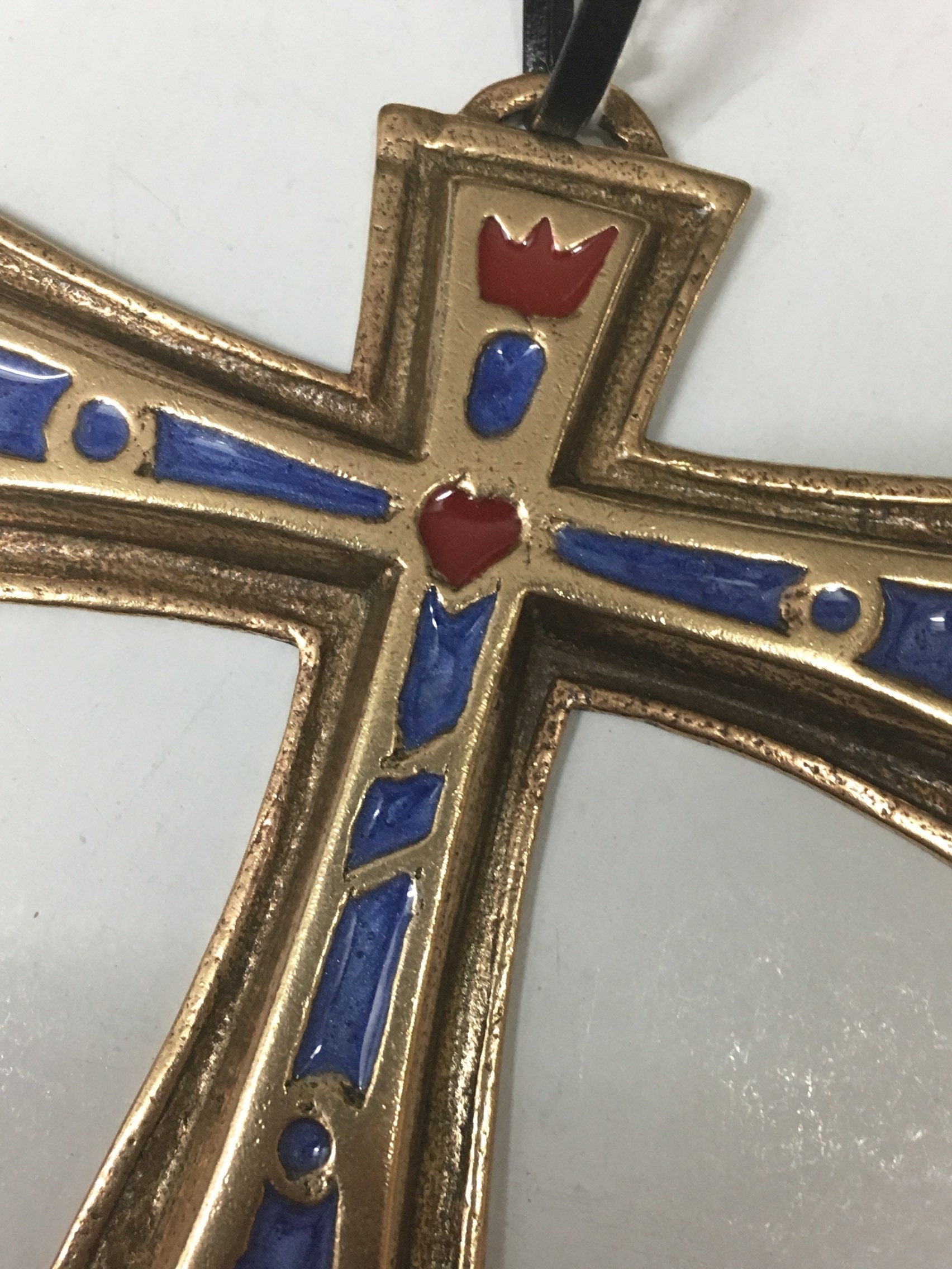 Religious Bronze Art. Enameled bronze cross vitrified blue and red