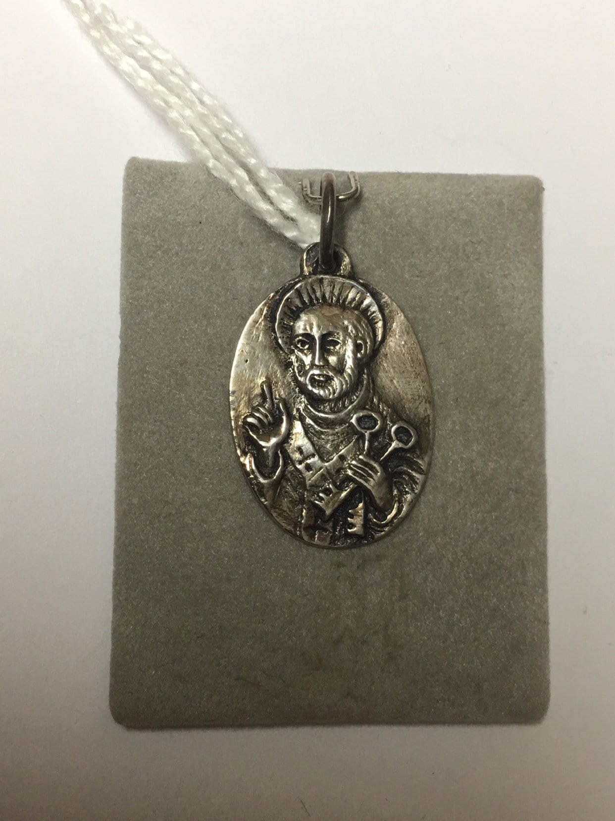 Religious medal in ancient stone saint silver