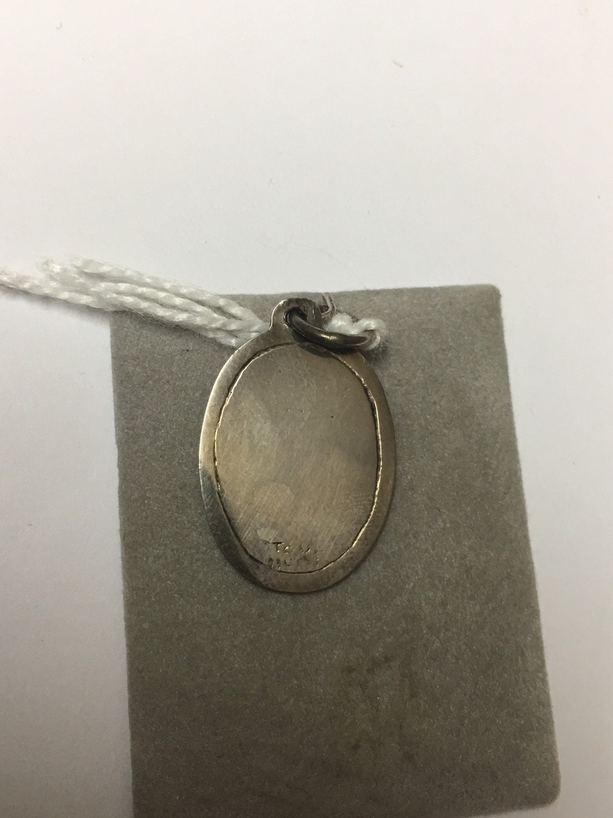Religious medal in ancient stone saint silver