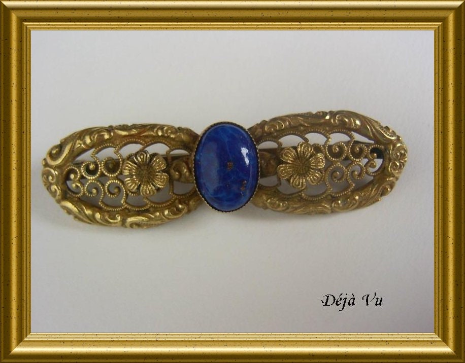 Vintage brooch with blue stone