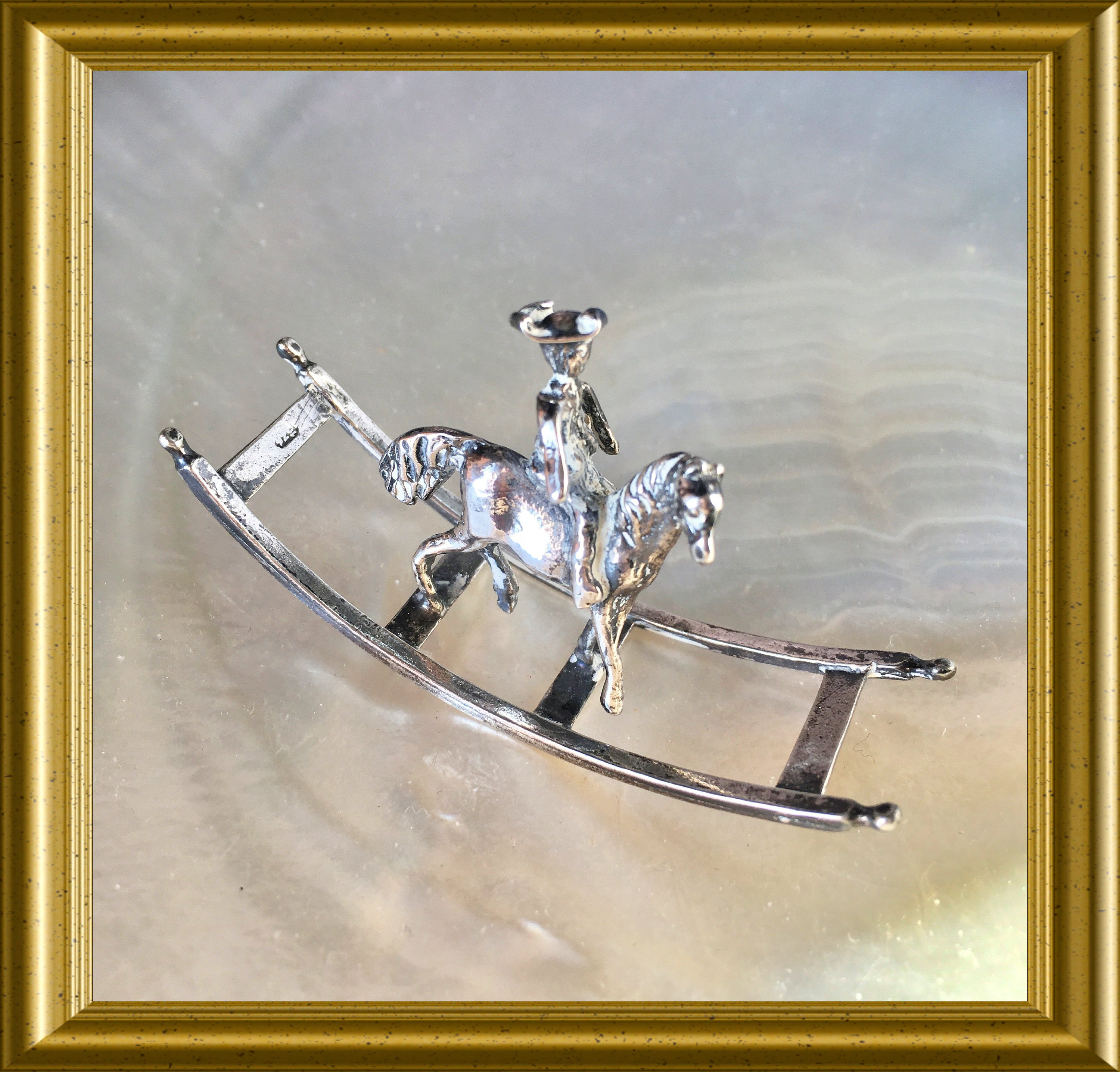 Miniature silver rocking horse
