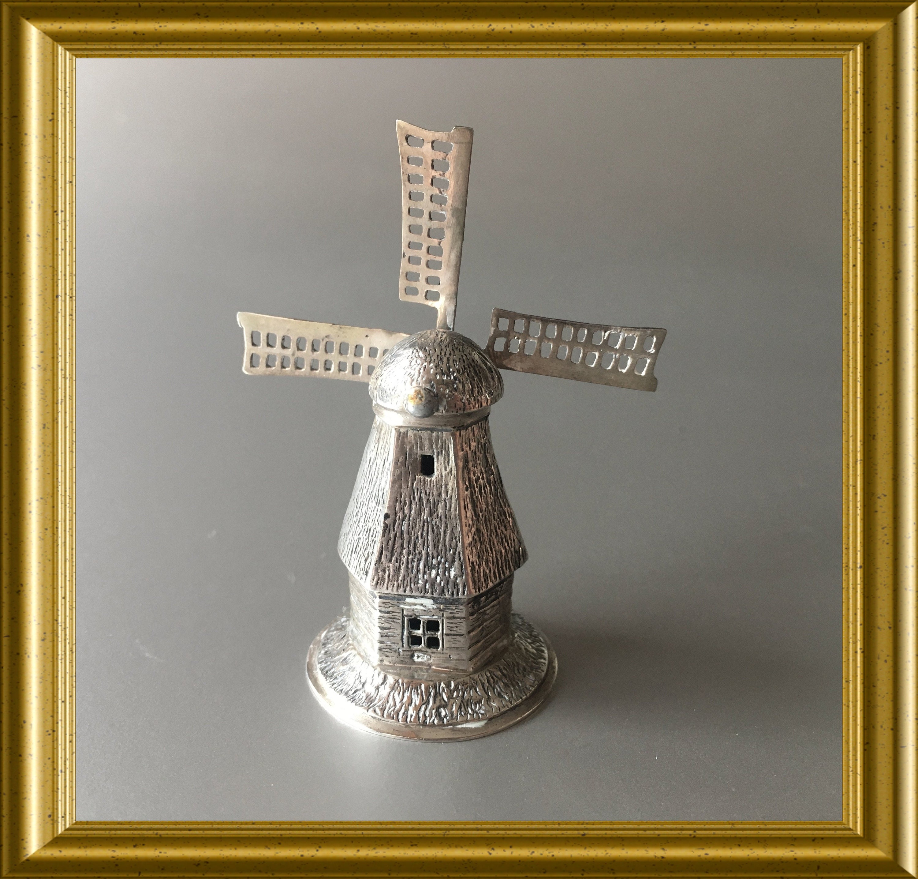 Miniature silver windmill with turnable blades, large model