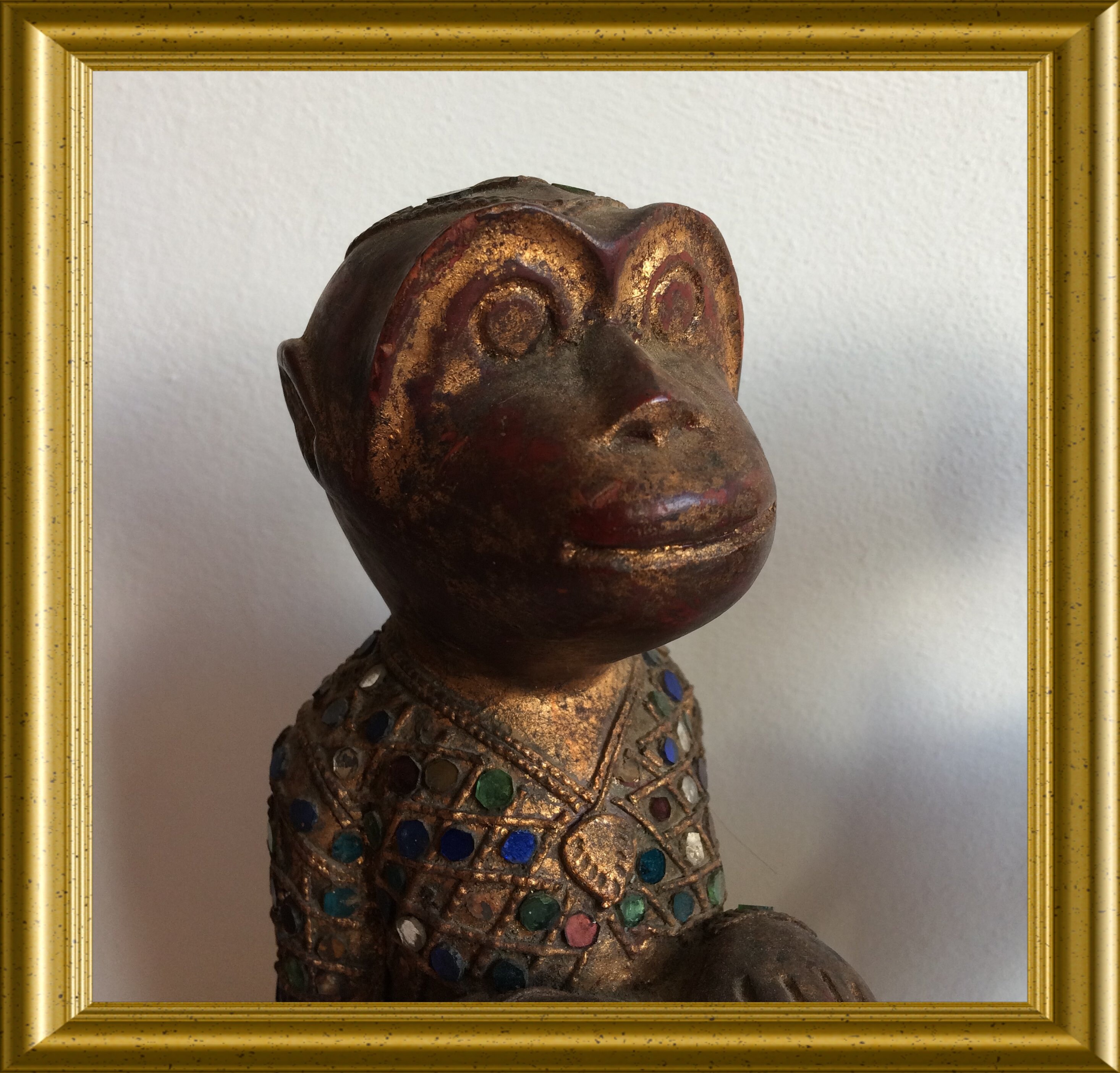 Two vintage wood carved monkeys, decorated with pieces of glass