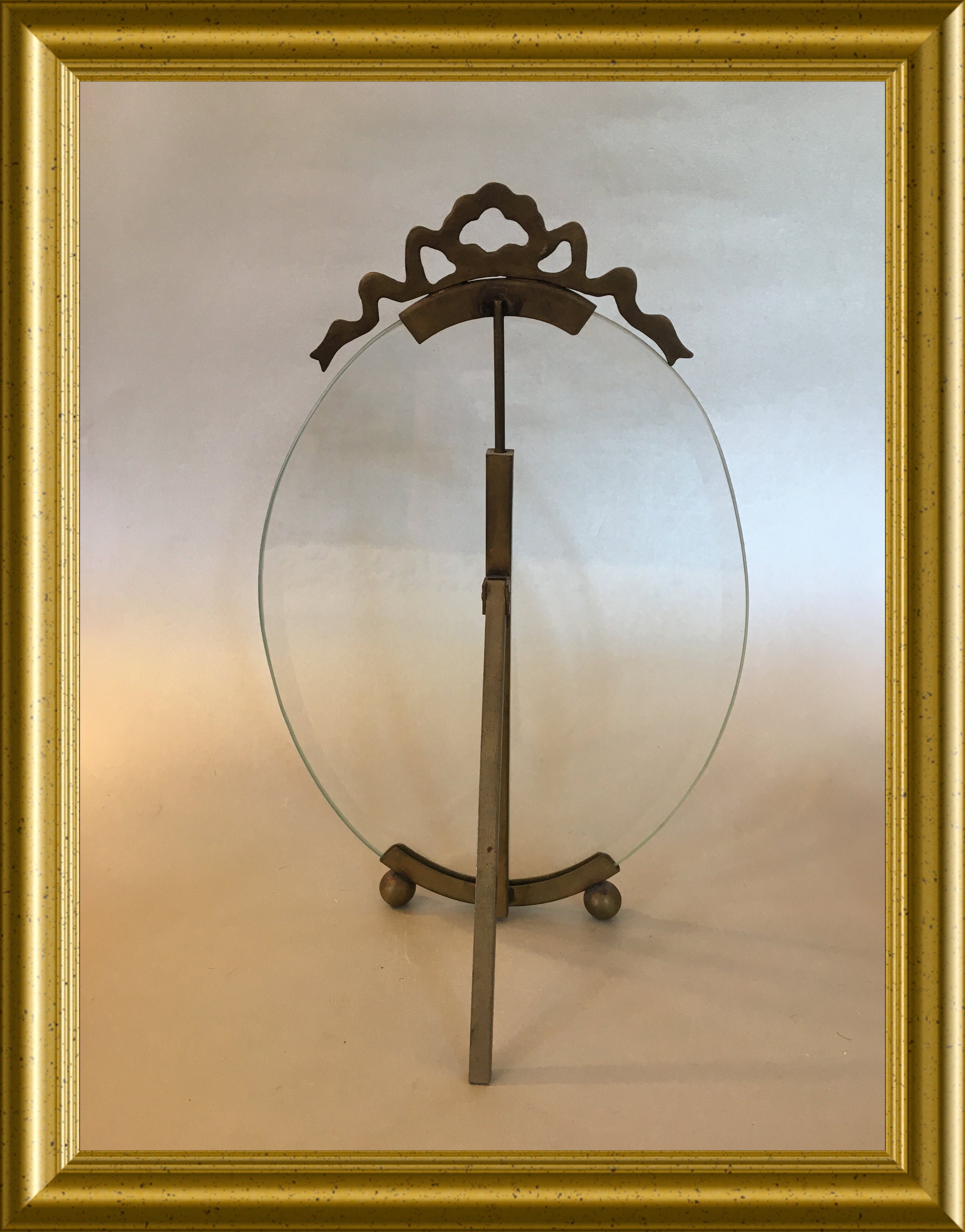Antique large oval picture frame with beveled glass and bow