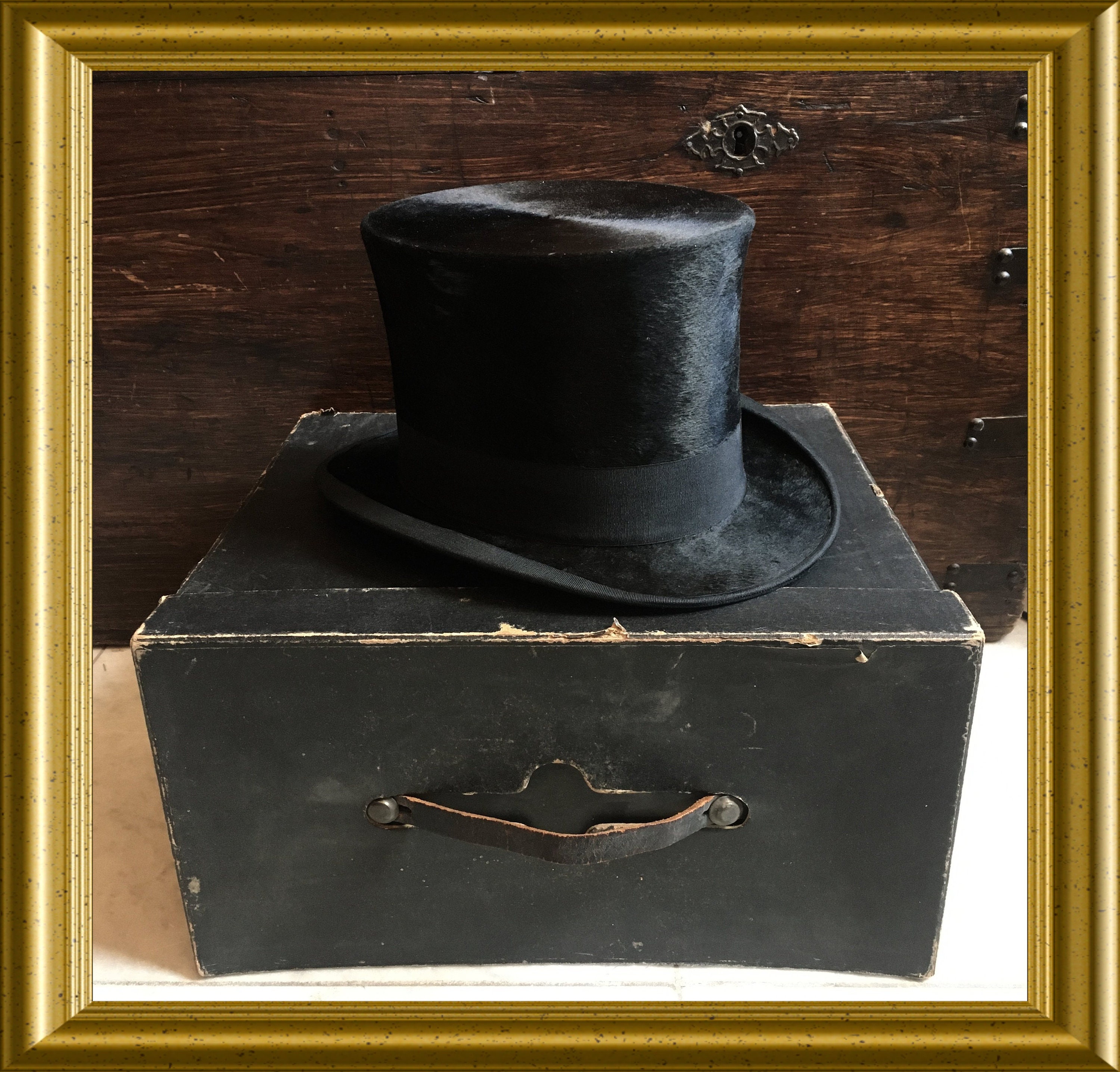 Antique black top hat with box, Burton